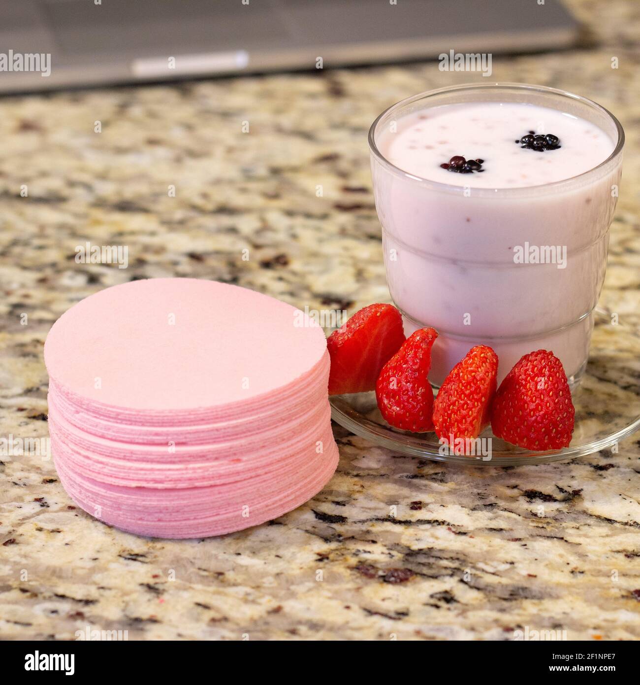 A delicious strawberry and blackberry smoothie with a strawberry wafer ...