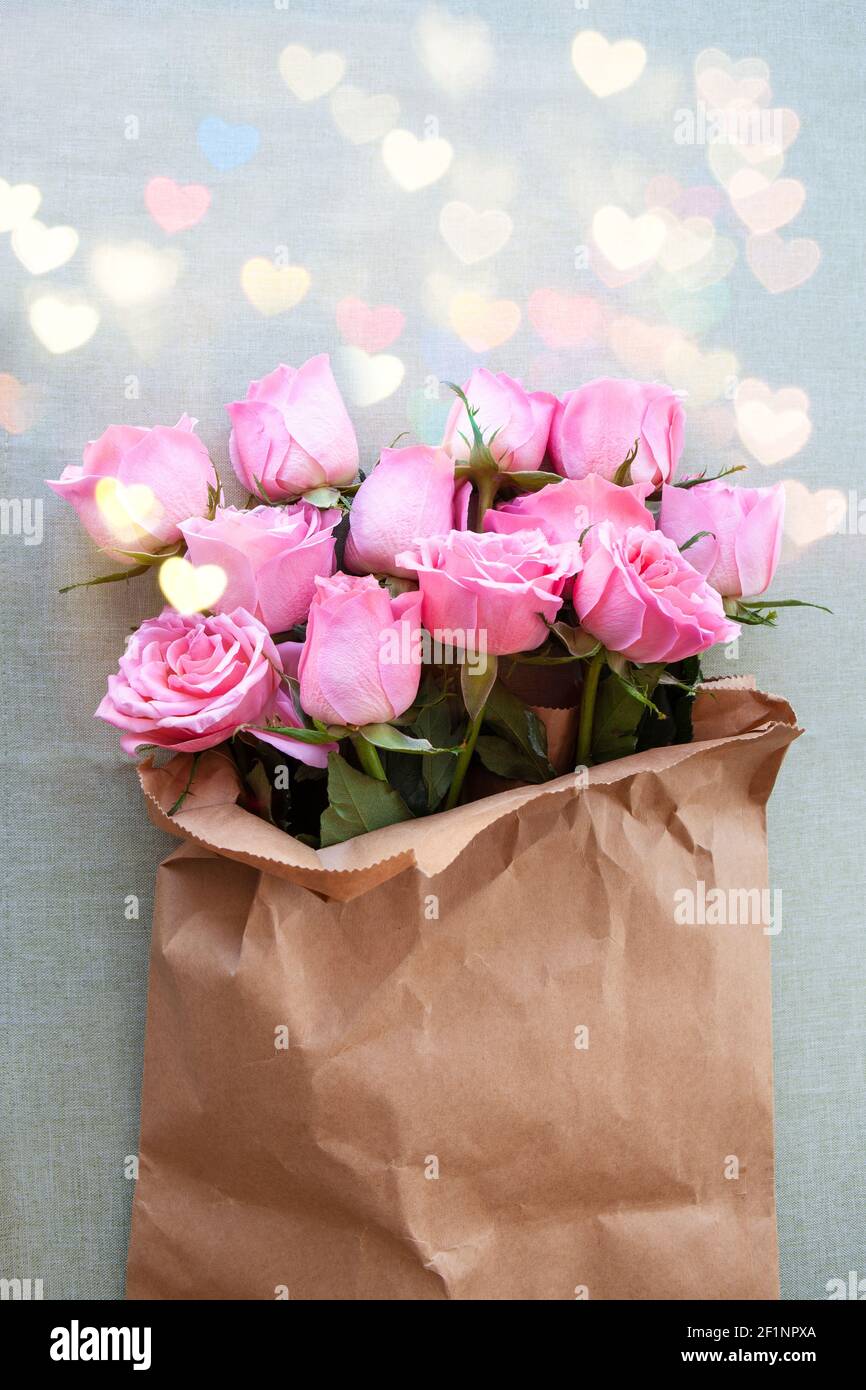 Pink roses in rustic paper bag Stock Photo - Alamy