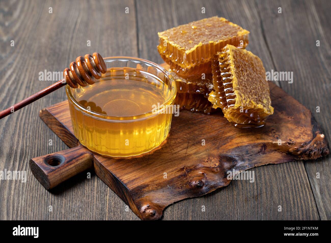 Honey and Honeycomb slice Stock Photo - Alamy