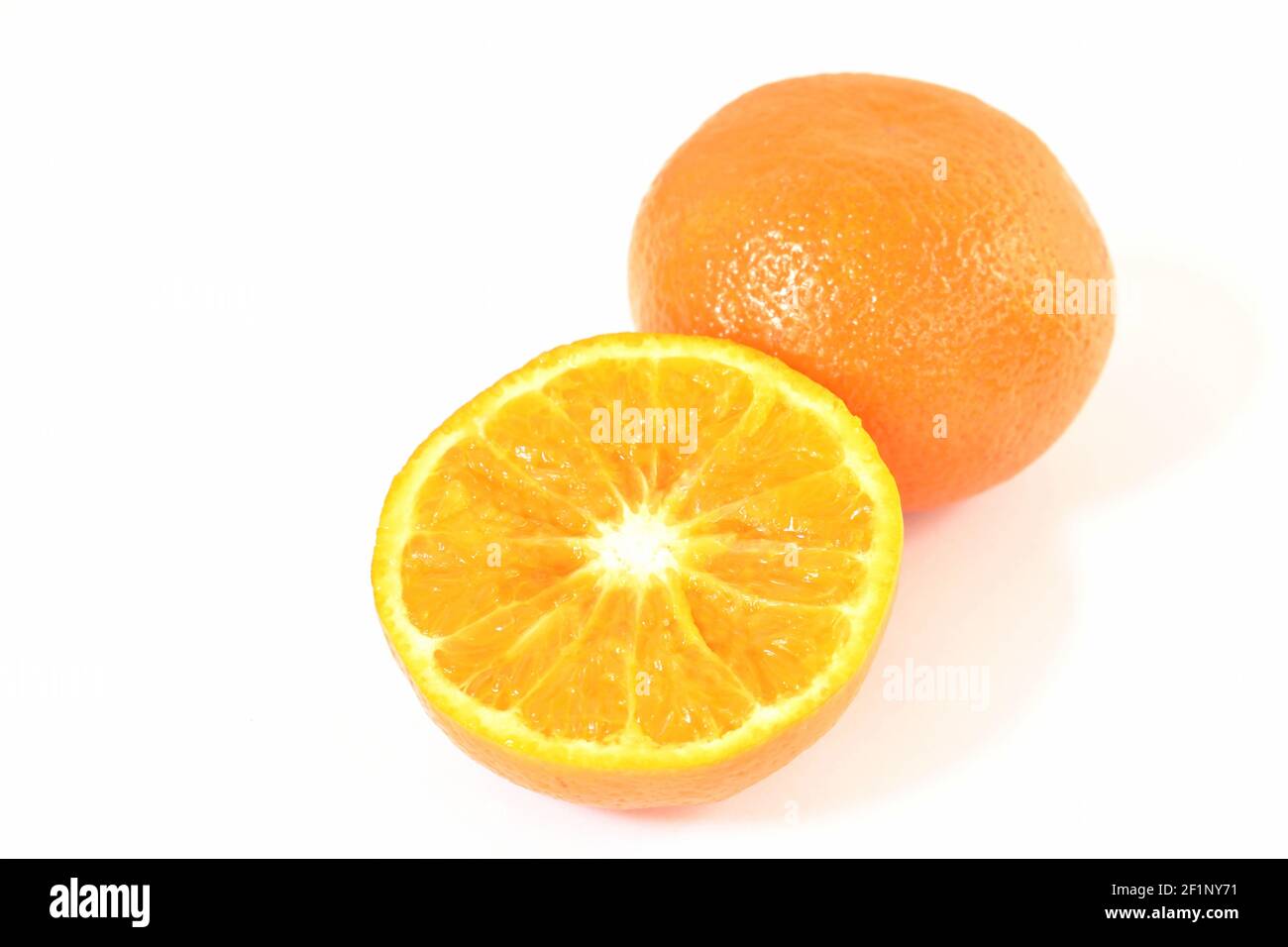 orange half cutting with water drop on white background Stock Photo - Alamy