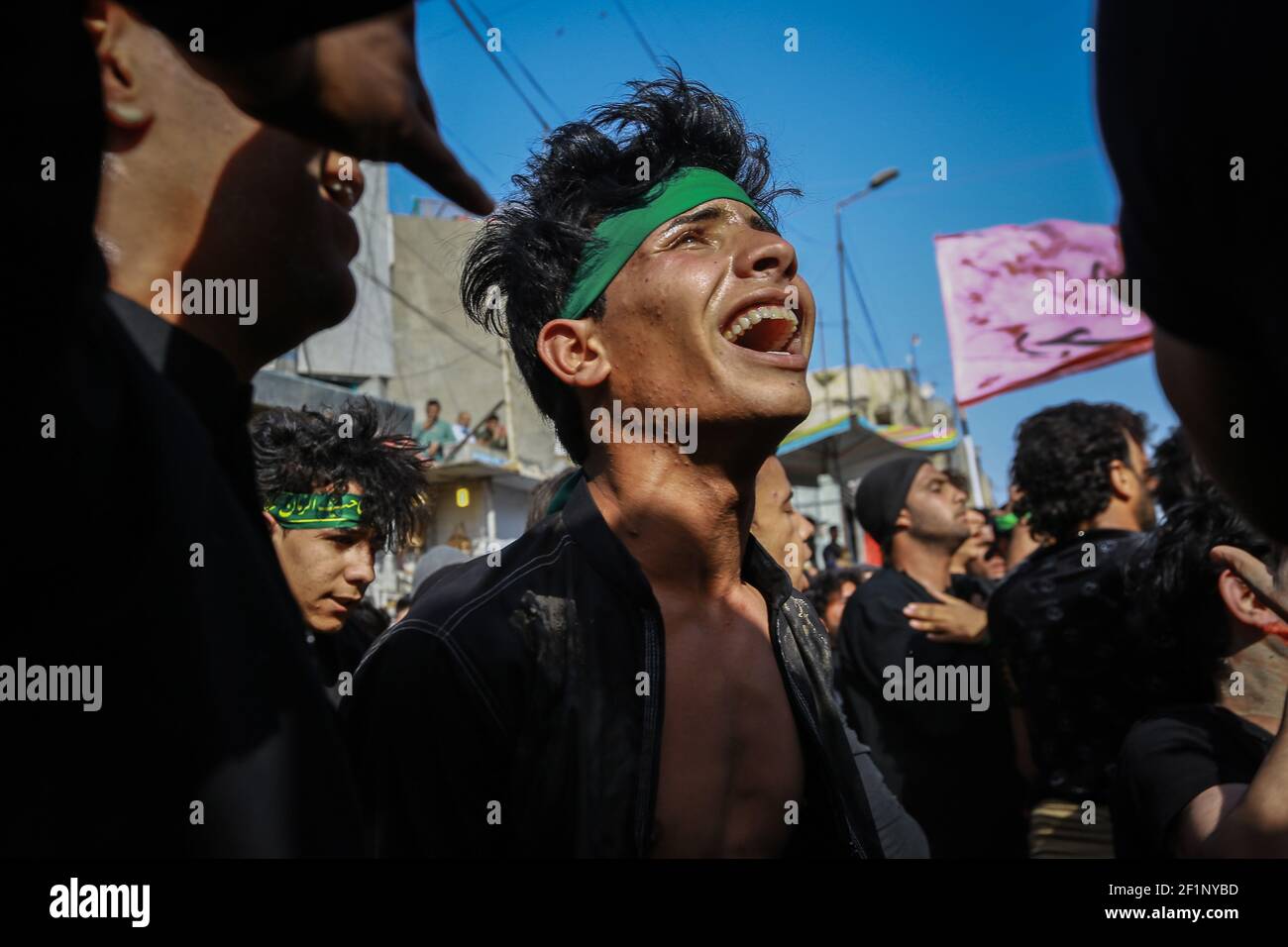 Baghdad, Iraq. 09th Mar, 2021. Iraqi Shiite Muslims take part in a ...