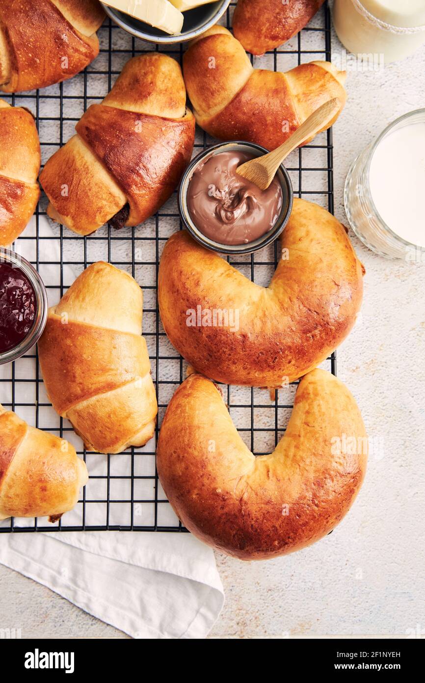 A vertical top view of deliciously prepared homemade croissants on a ...