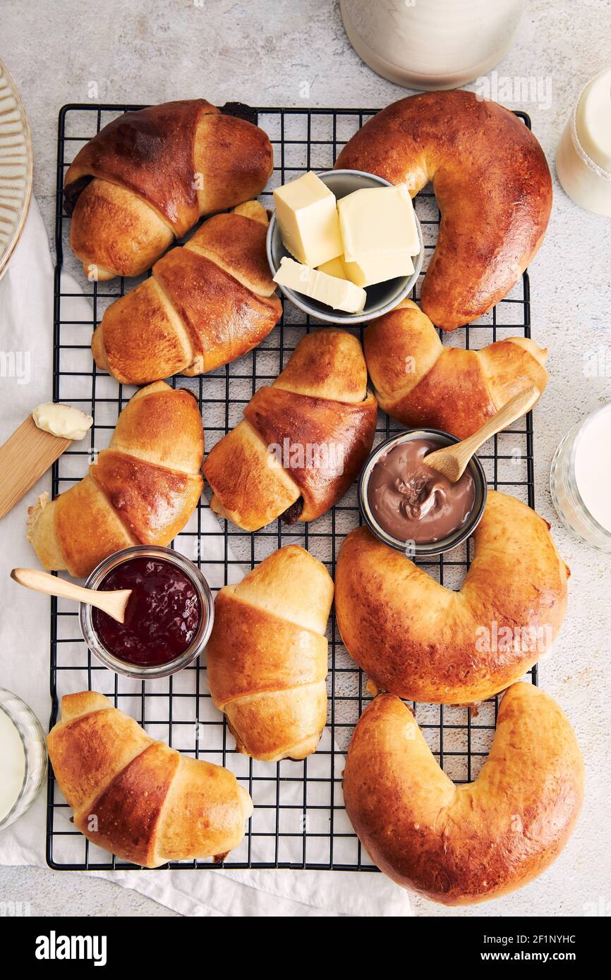 A vertical top view of deliciously prepared homemade croissants on a ...