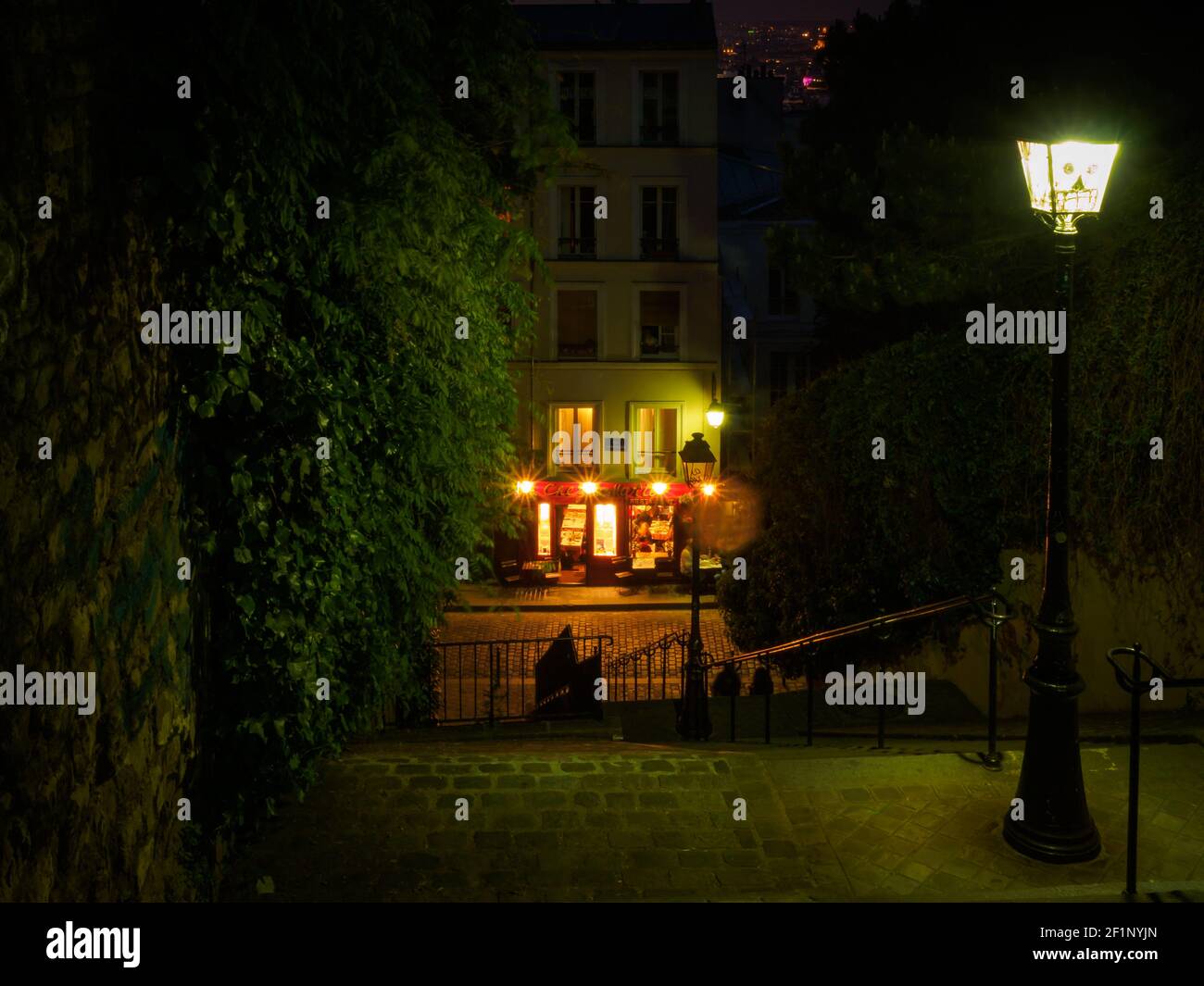 Steps lead up from the road in the Montmartre district of Paris at ...