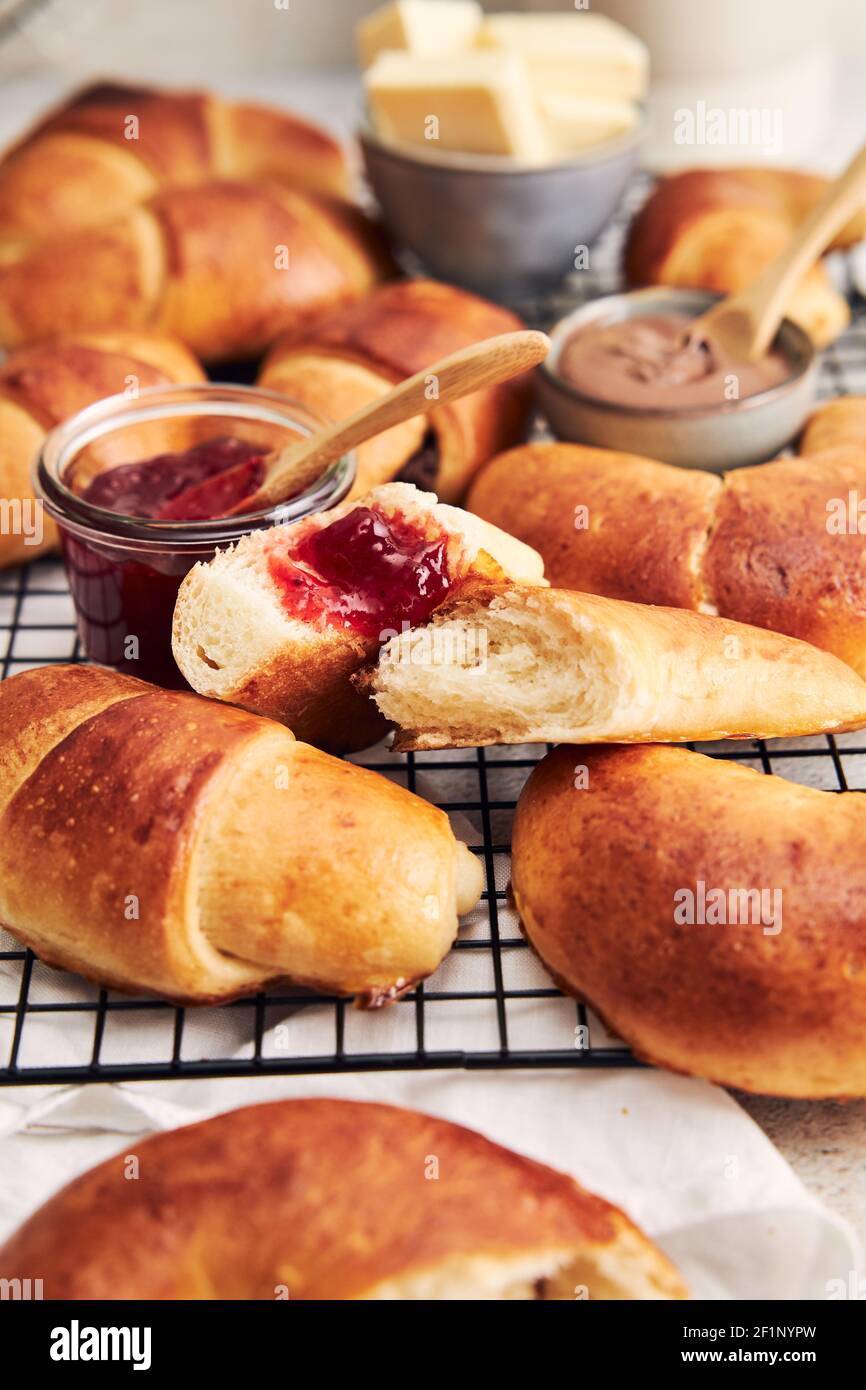 A vertical shot of deliciously prepared homemade croissants on a grid ...