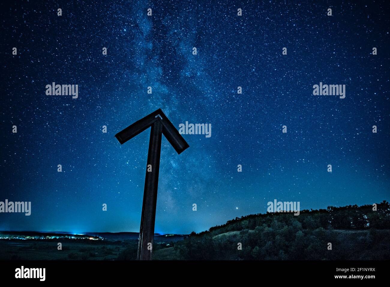 Arrow pointing milky way in night sky Stock Photo - Alamy