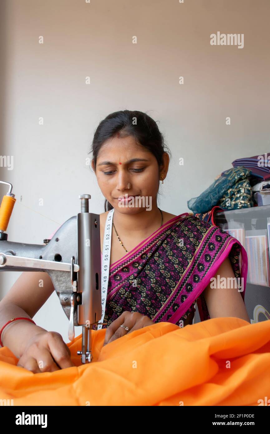 indian woman tailor or boutique owner at her workshop Stock Photo - Alamy