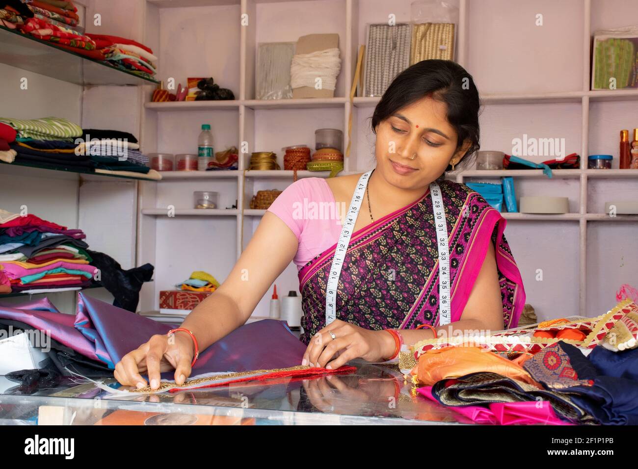 indian woman tailor or boutique owner at her workshop Stock Photo - Alamy