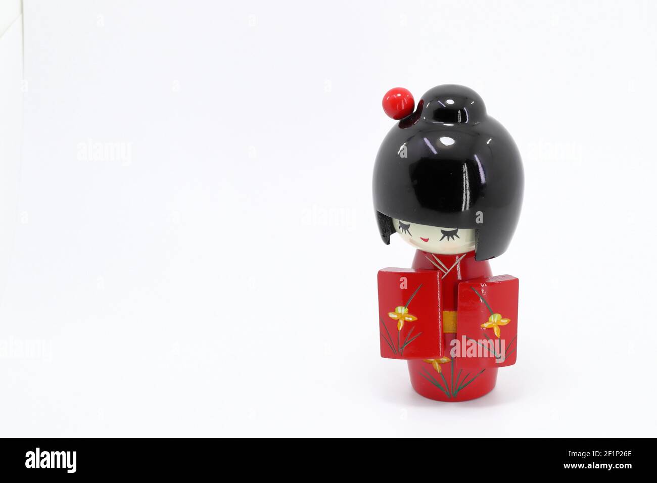 Japanese wooden dolls "kokeshi" in red Kimono suit, toy for a ...