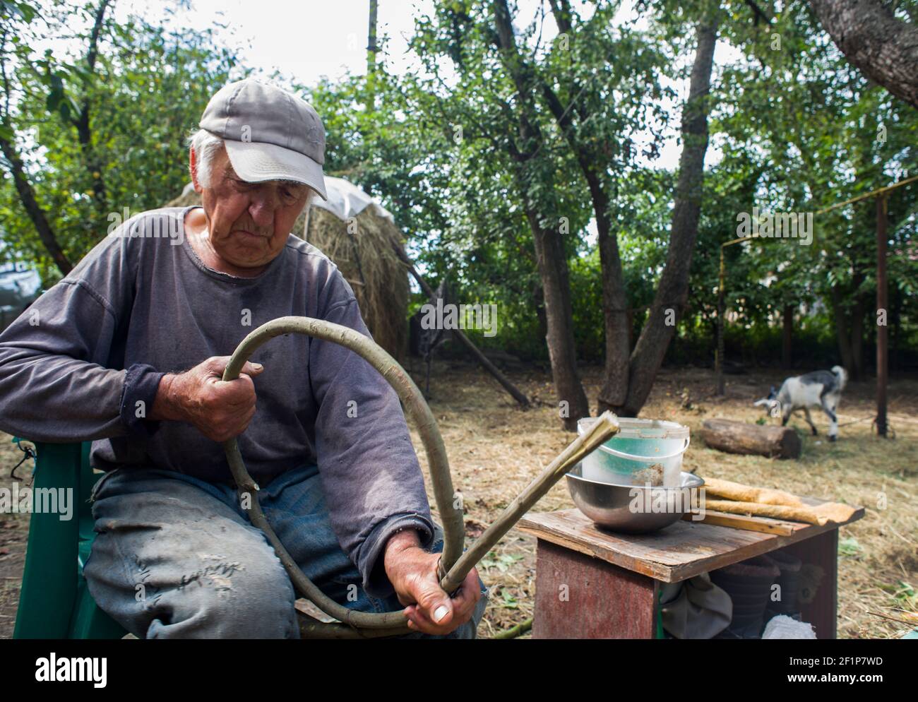 An old man, craftsman, bents furniture part Stock Photo - Alamy