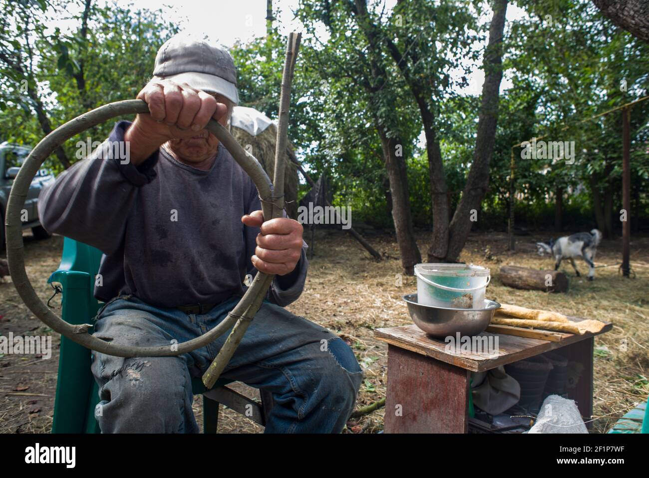 An old man, craftsman, bents furniture part Stock Photo - Alamy