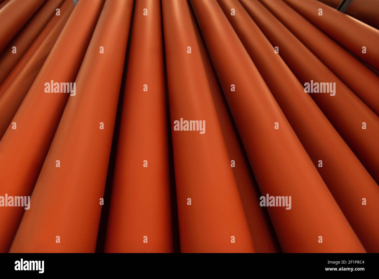 background of bright, red plastic tubes with copy space Stock Photo - Alamy