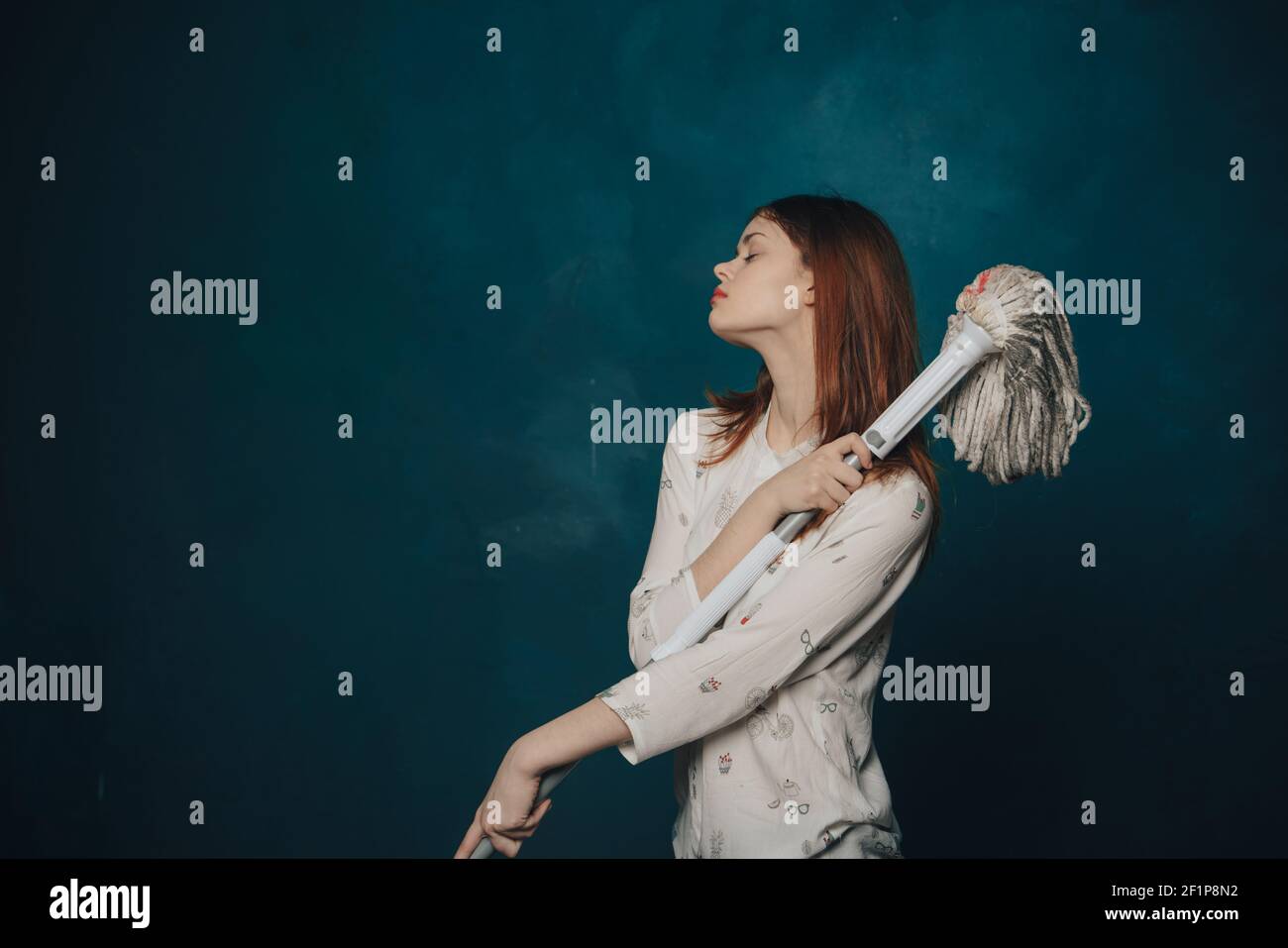 woman mop on blue background gestures with hands emotions Copy Space ...
