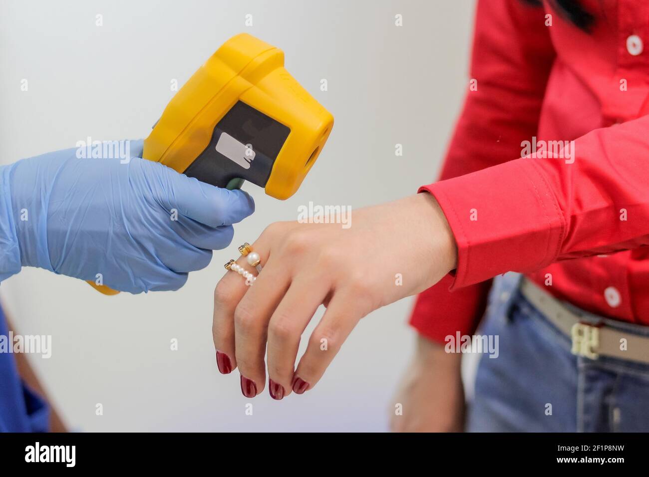 An individual practicing hand hygiene, a vital step in preventing the ...