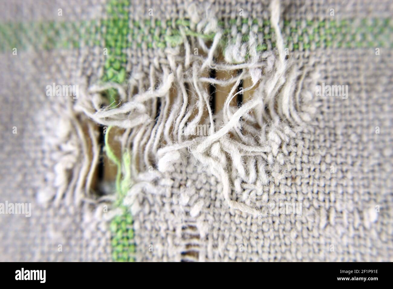 colored cotton weaving, consumed by the wear of time Stock Photo - Alamy