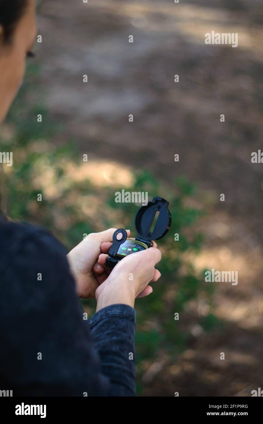 girl with a compass in her hands Stock Photo - Alamy