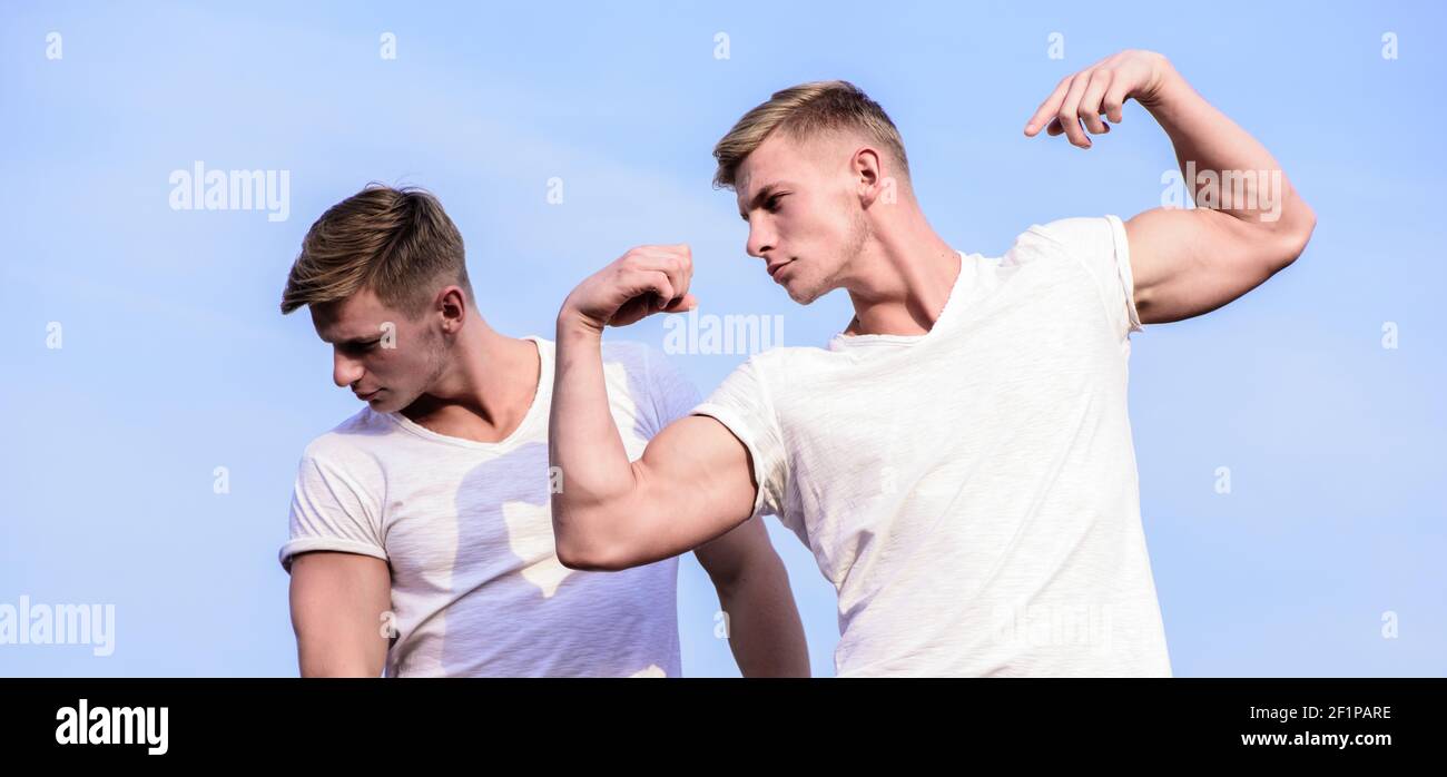 Attractive twins. Sport lifestyle and healthy body. Men twins brothers ...