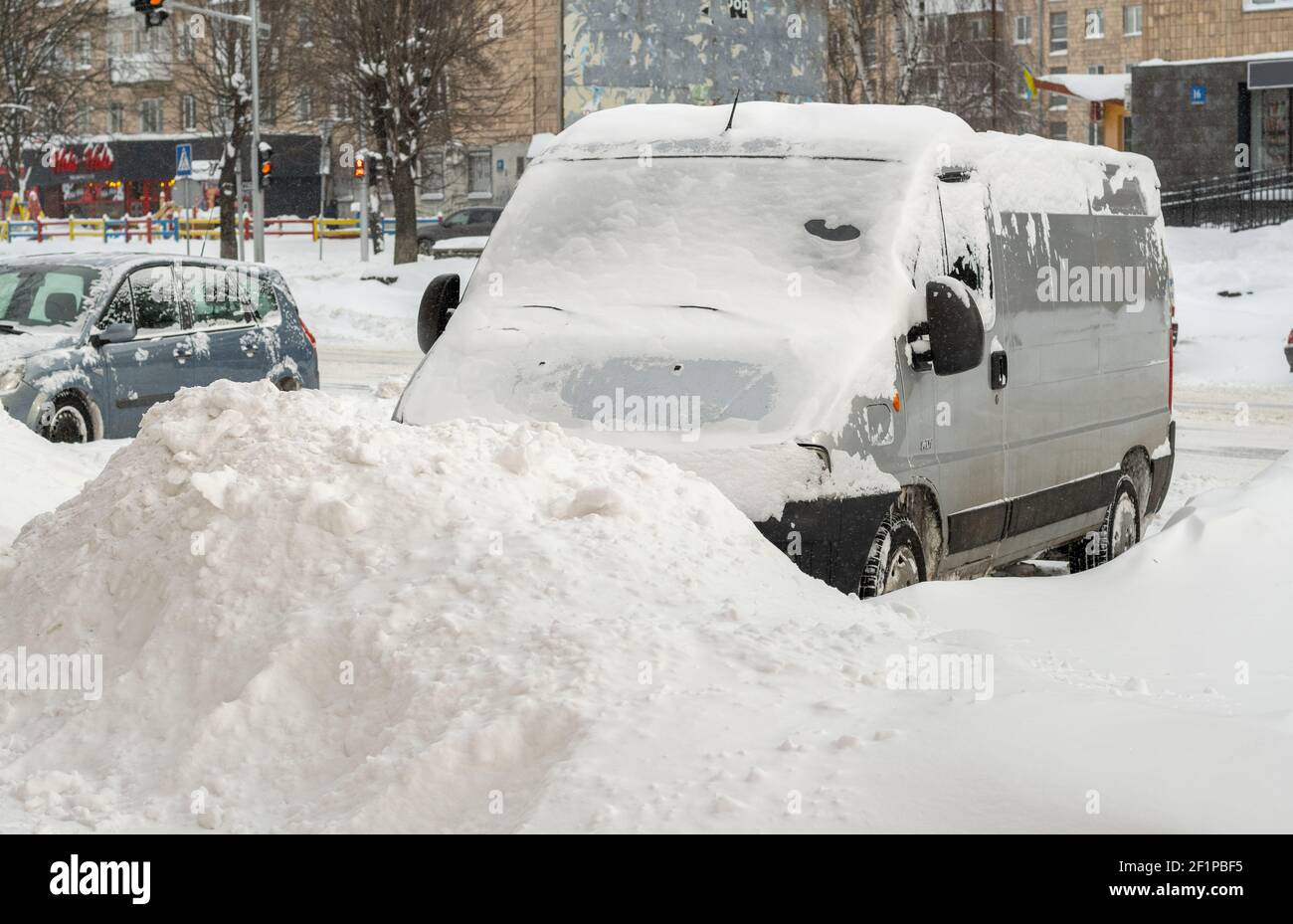 Lutsk, Ukraine - February 12,2020: City street after blizzard. Stuck ...