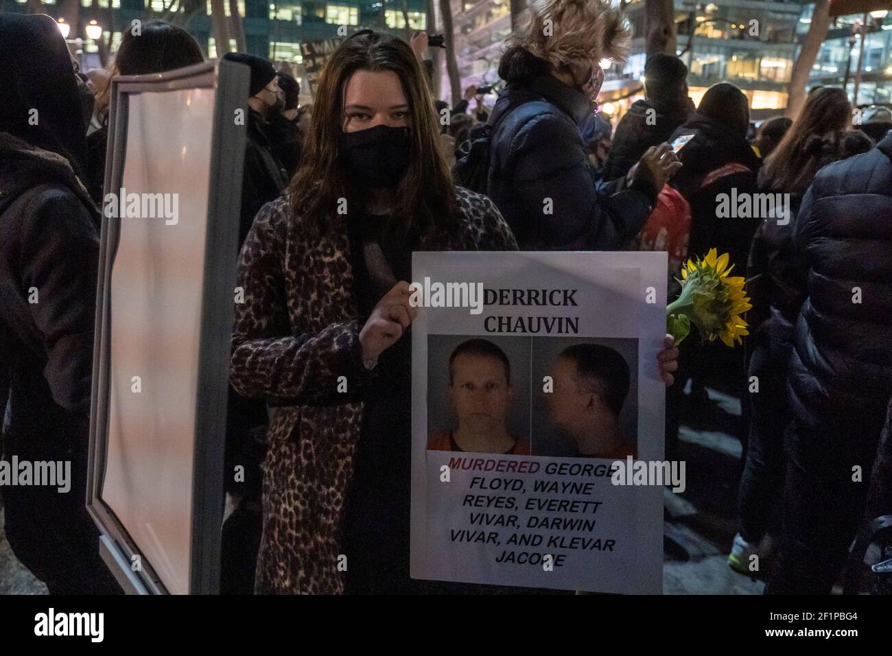 New York, United States. 08th Mar, 2021. A protester holding a portrait ...