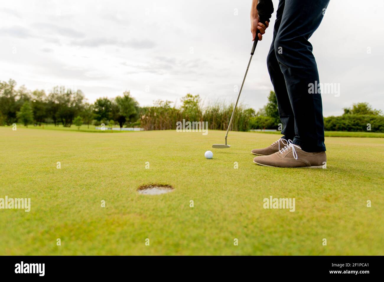 Closeup of young man legs playing golf Stock Photo - Alamy