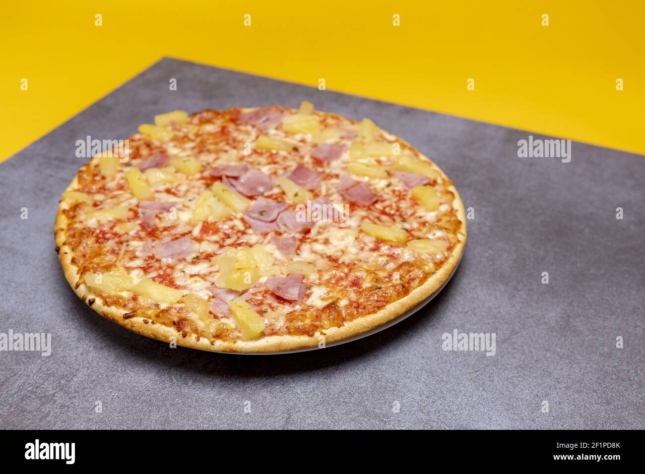 Modern kitchen gray surface with simple Hawai pineapple ham oven pizza ...