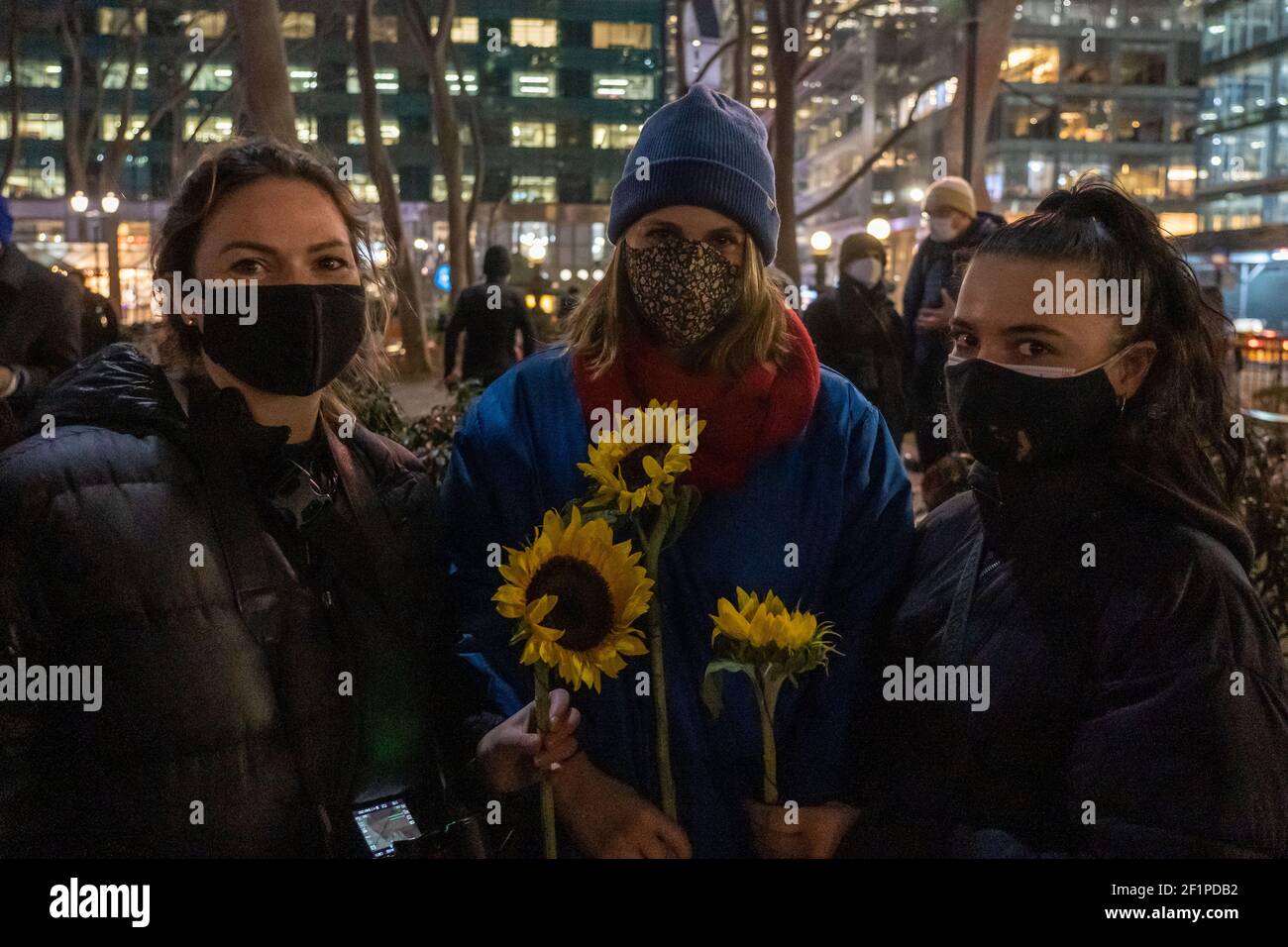 Protesters holding flowers in Bryant Park during the demonstration ...
