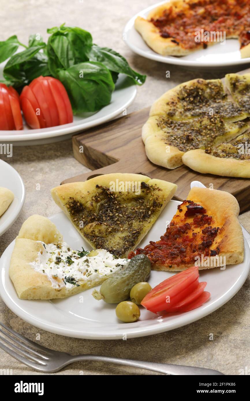 manakeesh, lebantine pizza, topping with zaatar(thyme), labneh(strained ...