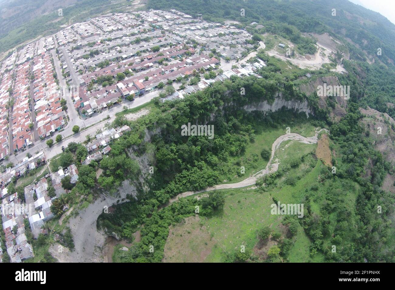Aerial view of a housing complex located near a river and surrounded by ...