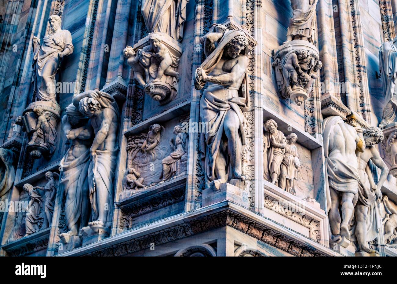 Exterior of Milan Duomo with detailed statues Stock Photo - Alamy