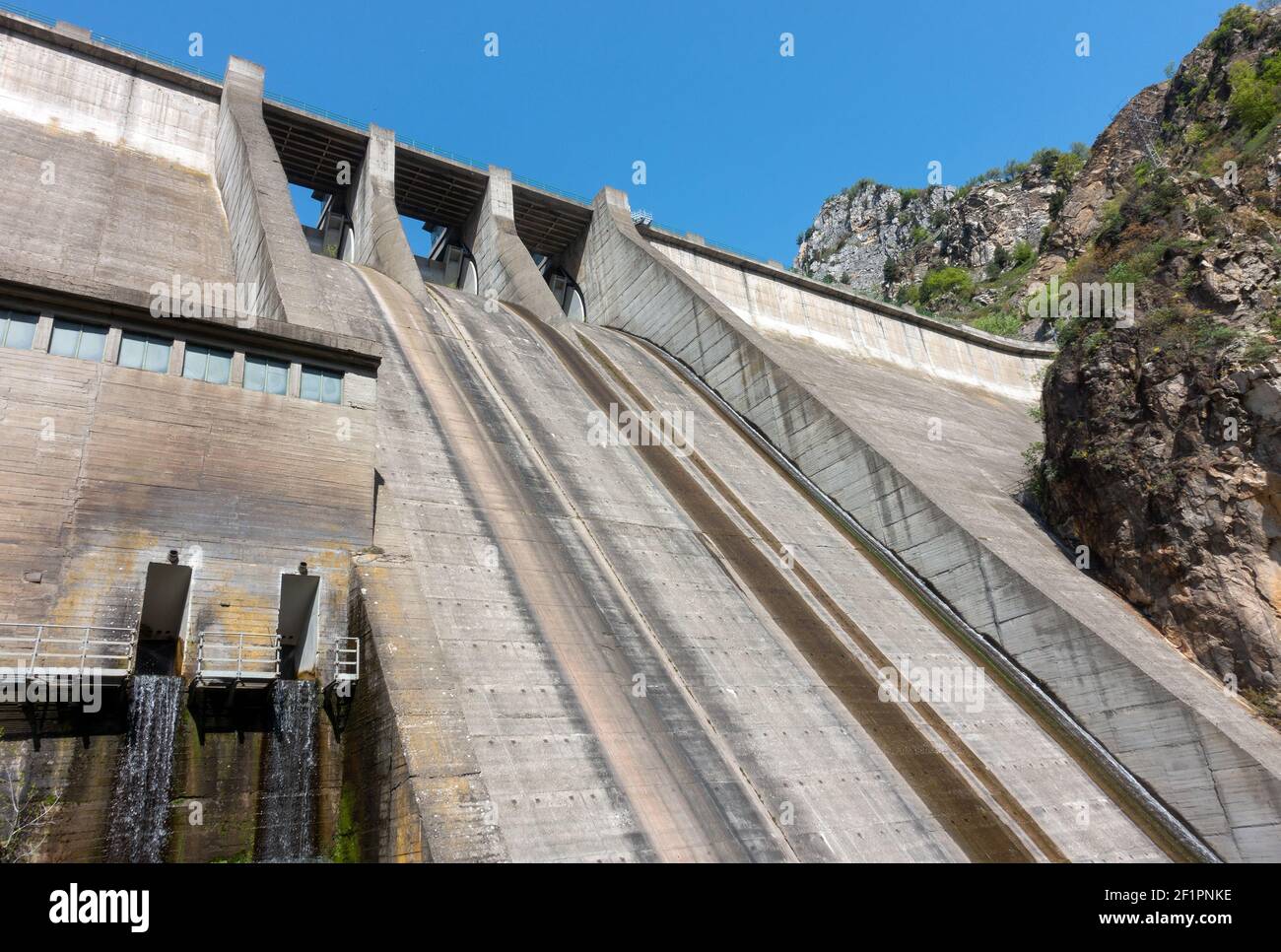 High concrete dam wall view Stock Photo - Alamy