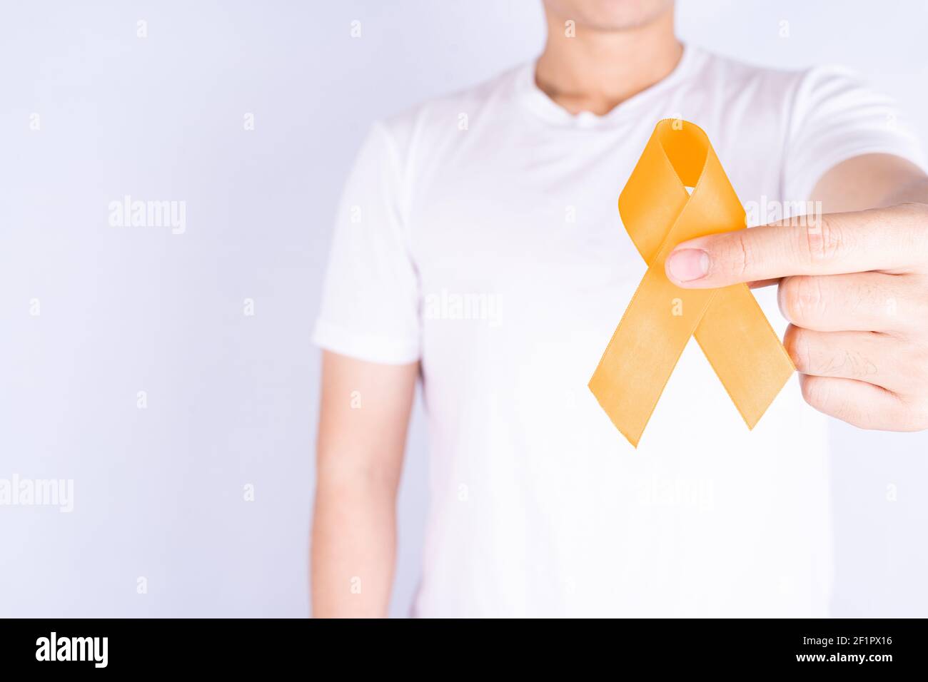 World kidney day, hands holding orange ribbon awareness of kidney ...