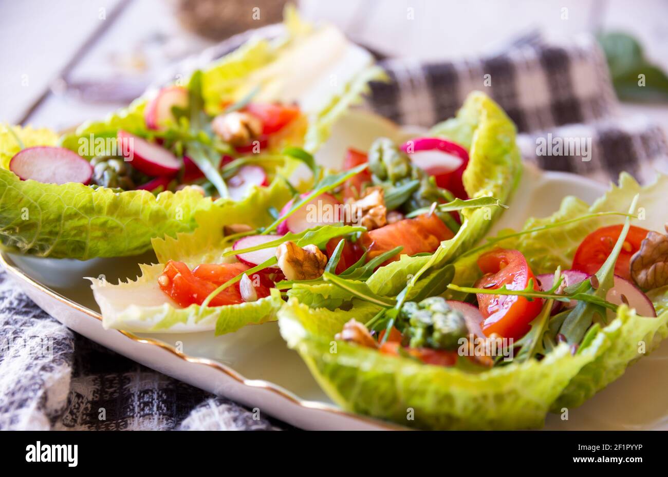 Vegetable salad served in lettuce leaves, healthy food or snack Stock ...