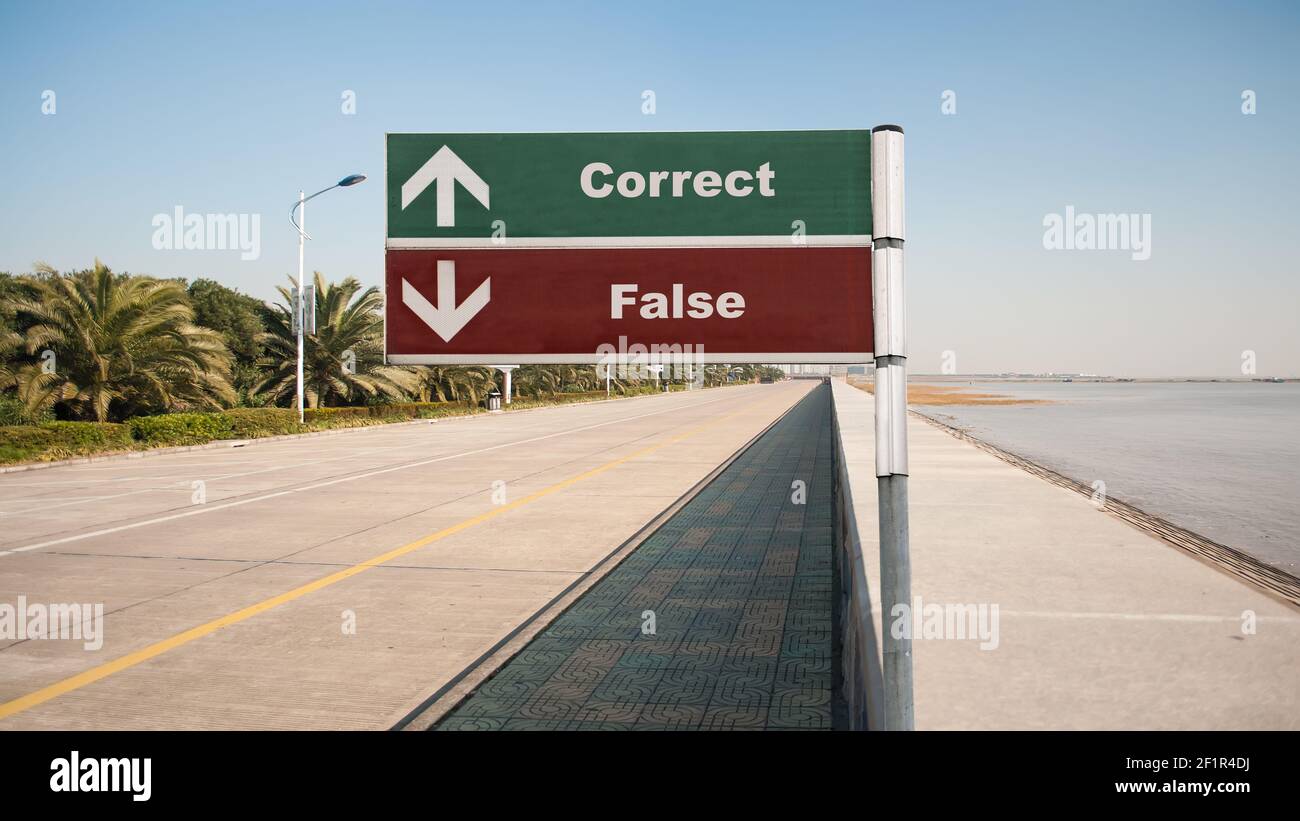Street Sign the Direction Way to Correct versus False Stock Photo - Alamy