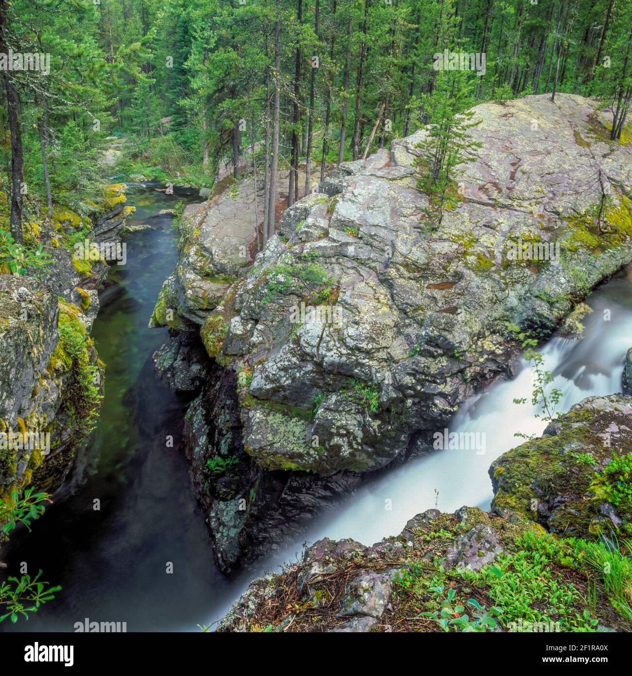 waterfall on the jocko river plunging into a gorge near arlee, montana ...