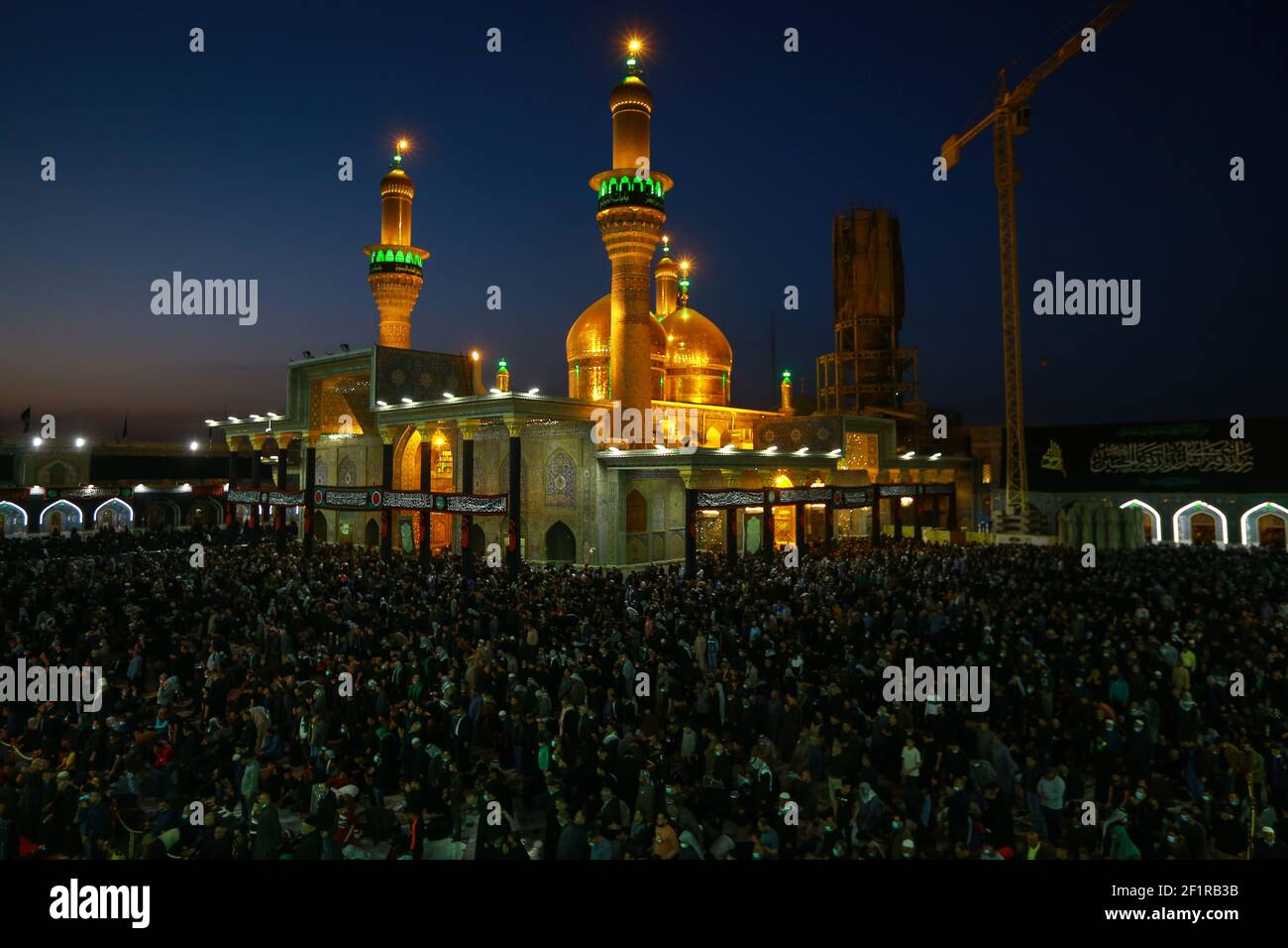 Baghdad, Iraq. 09th Mar, 2021. Iraqi Shiite Muslims gather during a ...
