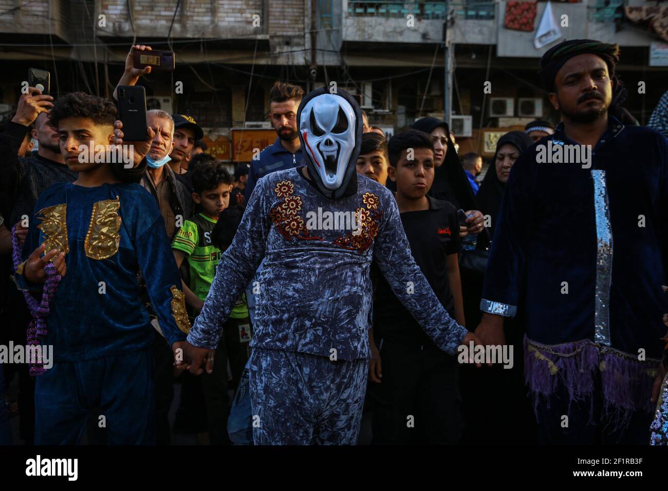 Baghdad, Iraq. 09th Mar, 2021. Costumed Iraqi Shiite Muslims take part ...