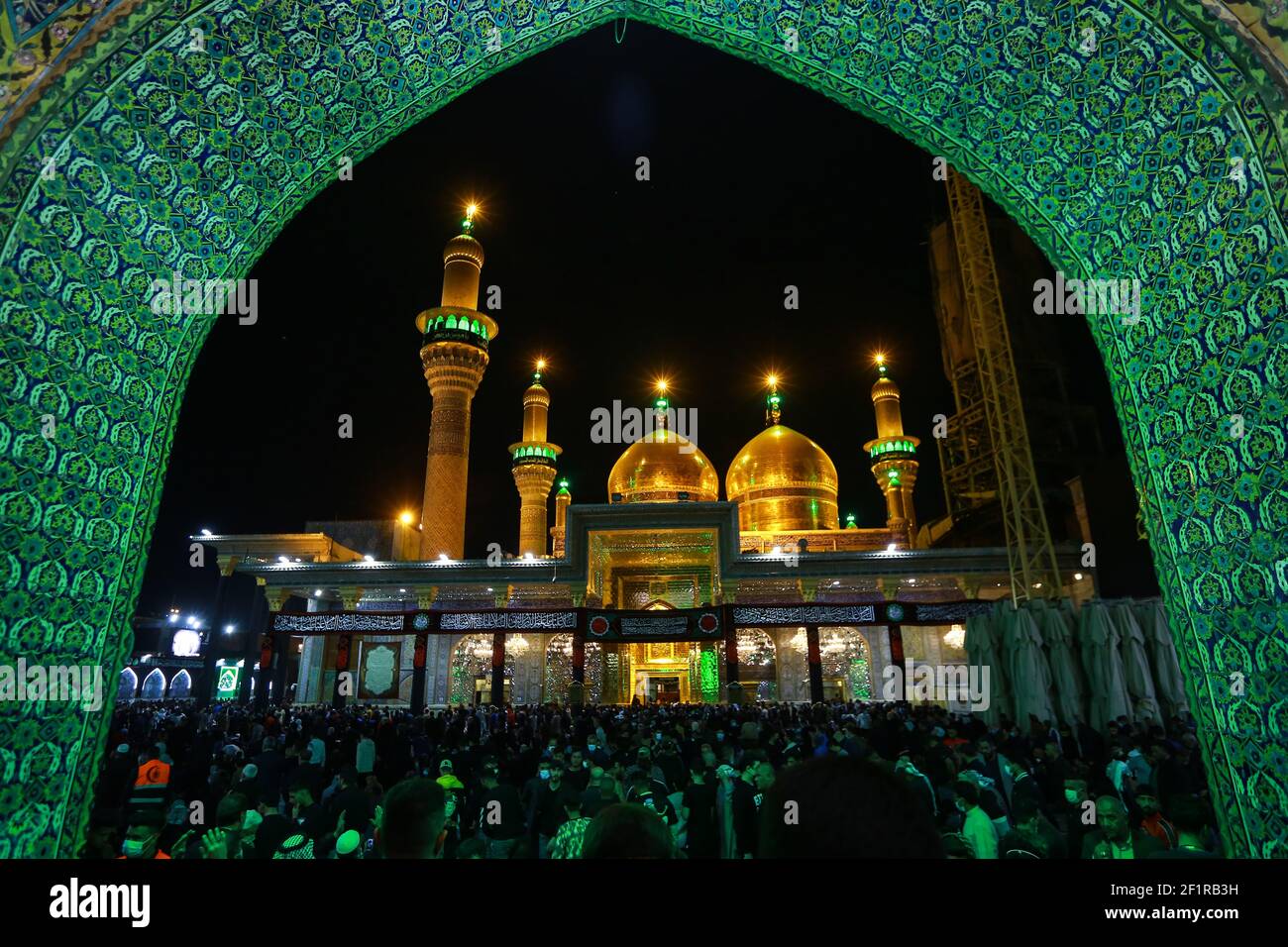 Baghdad, Iraq. 09th Mar, 2021. Iraqi Shiite Muslims gather during a ...