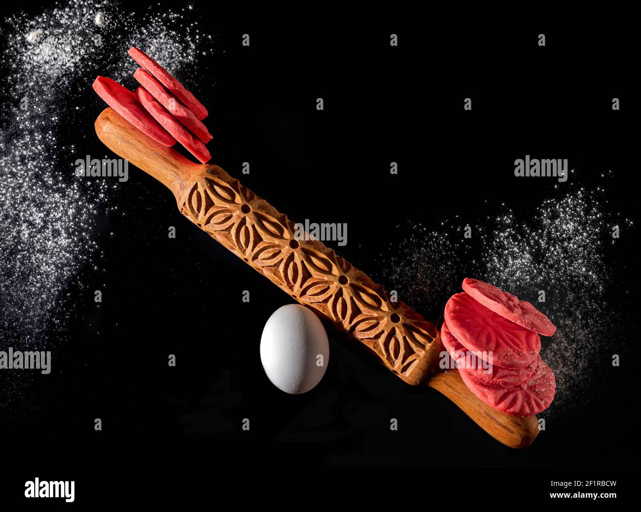 Red Sable Breton cookies in a balancing design with a rolling pin and ...