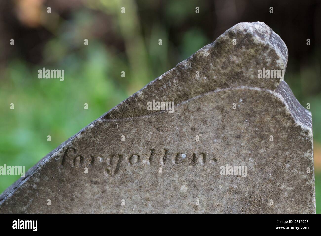 Close up of word "forgotten" on an old grave marker Stock Photo - Alamy