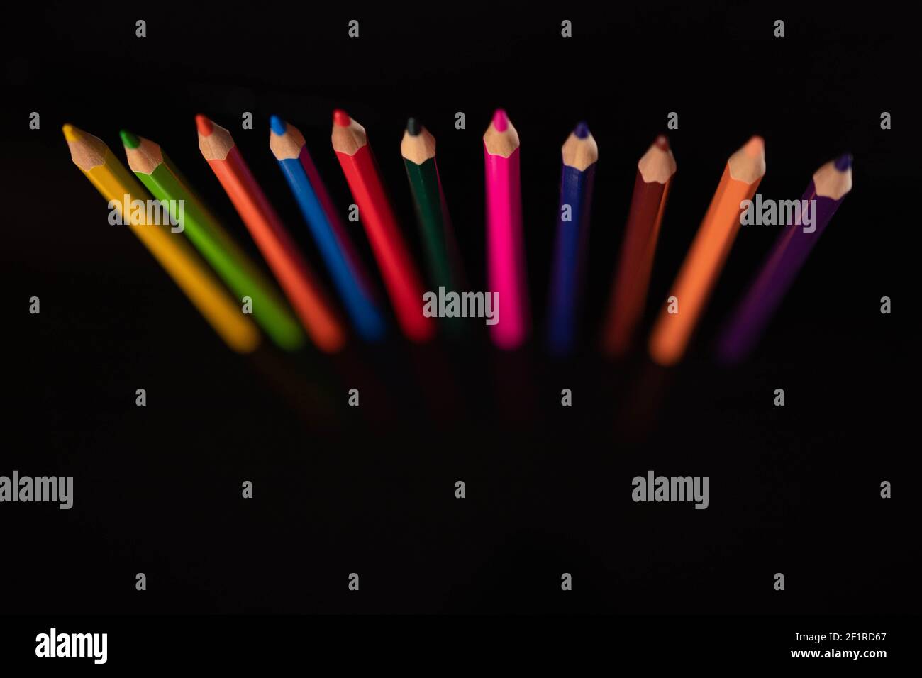 A top view closeup view of various colored pencils put together in a ...