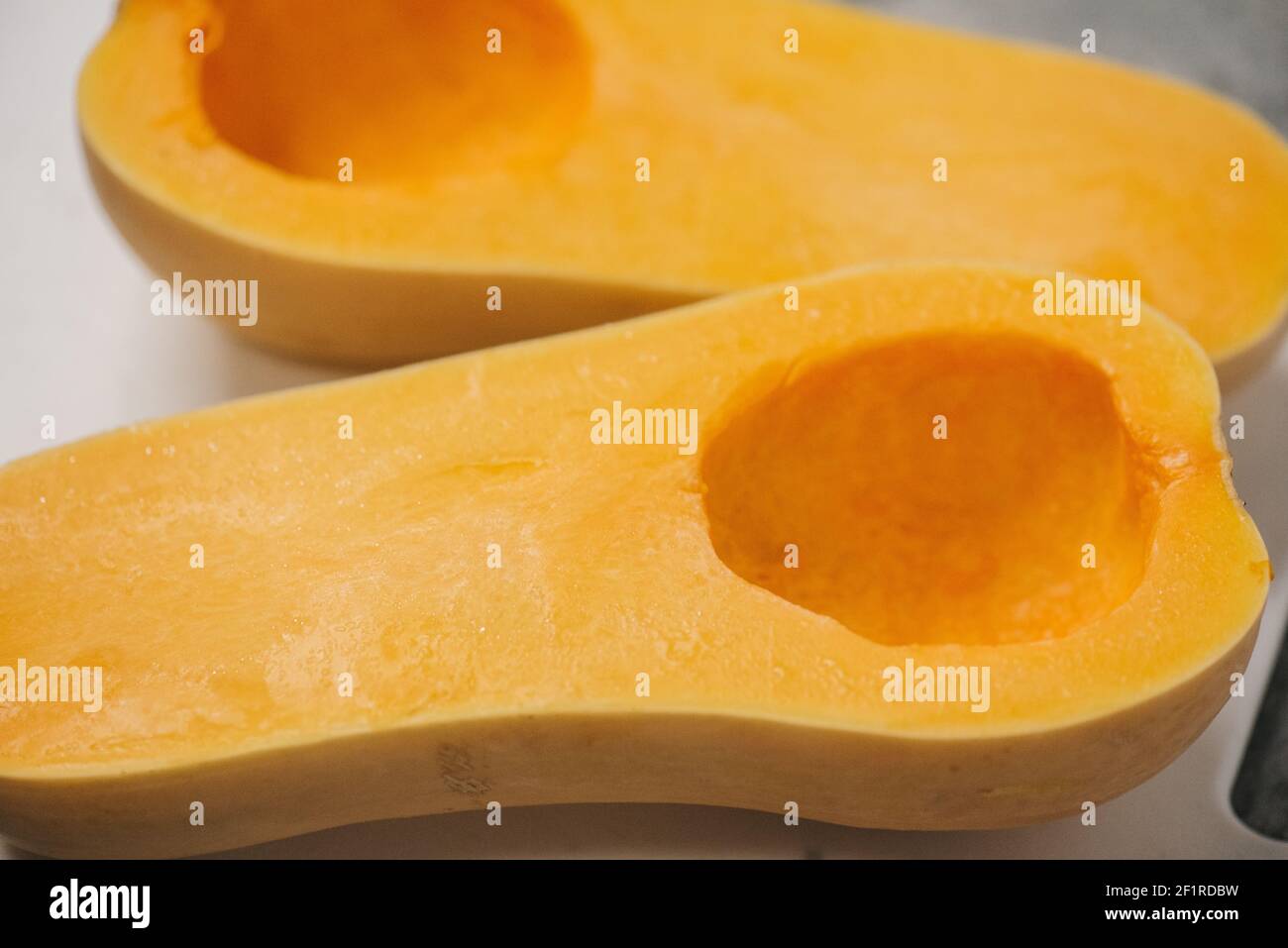 Cut and scooped fresh butternut squash Stock Photo - Alamy
