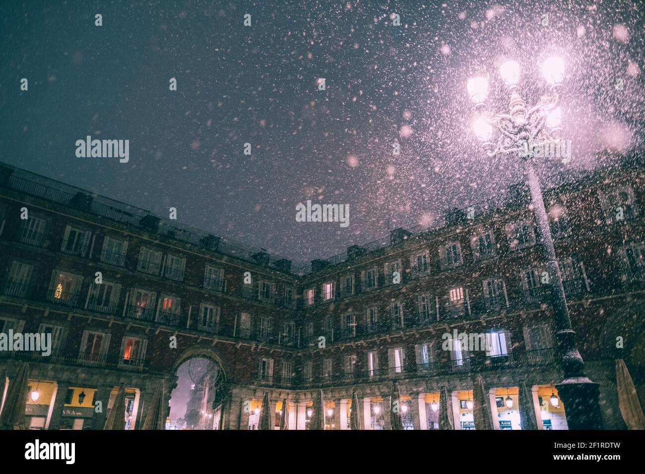 Lights of Plaza Mayor of Madrid during heavy snow blizzard in Spain ...