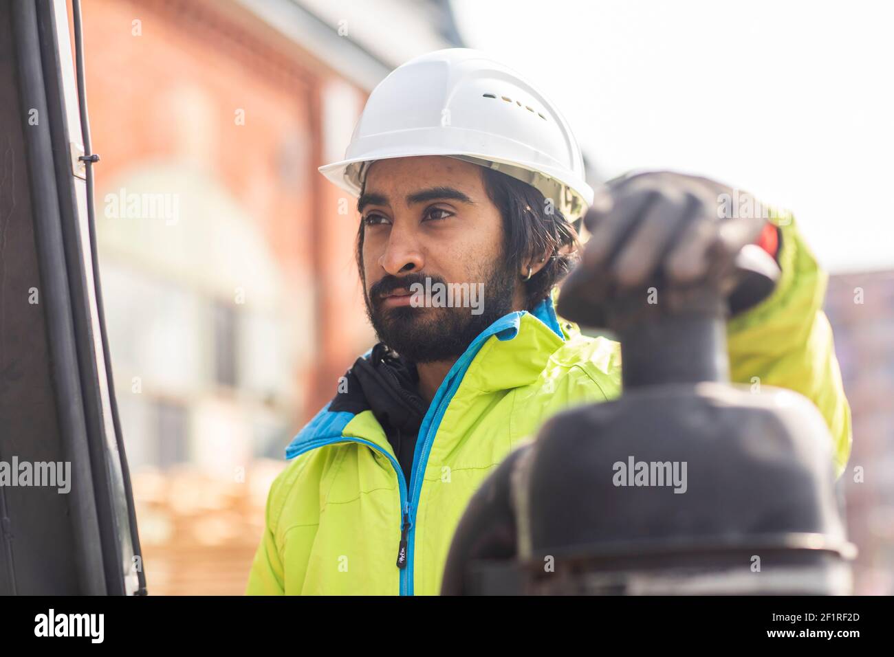 Young man working with helmet hi-res stock photography and images - Alamy