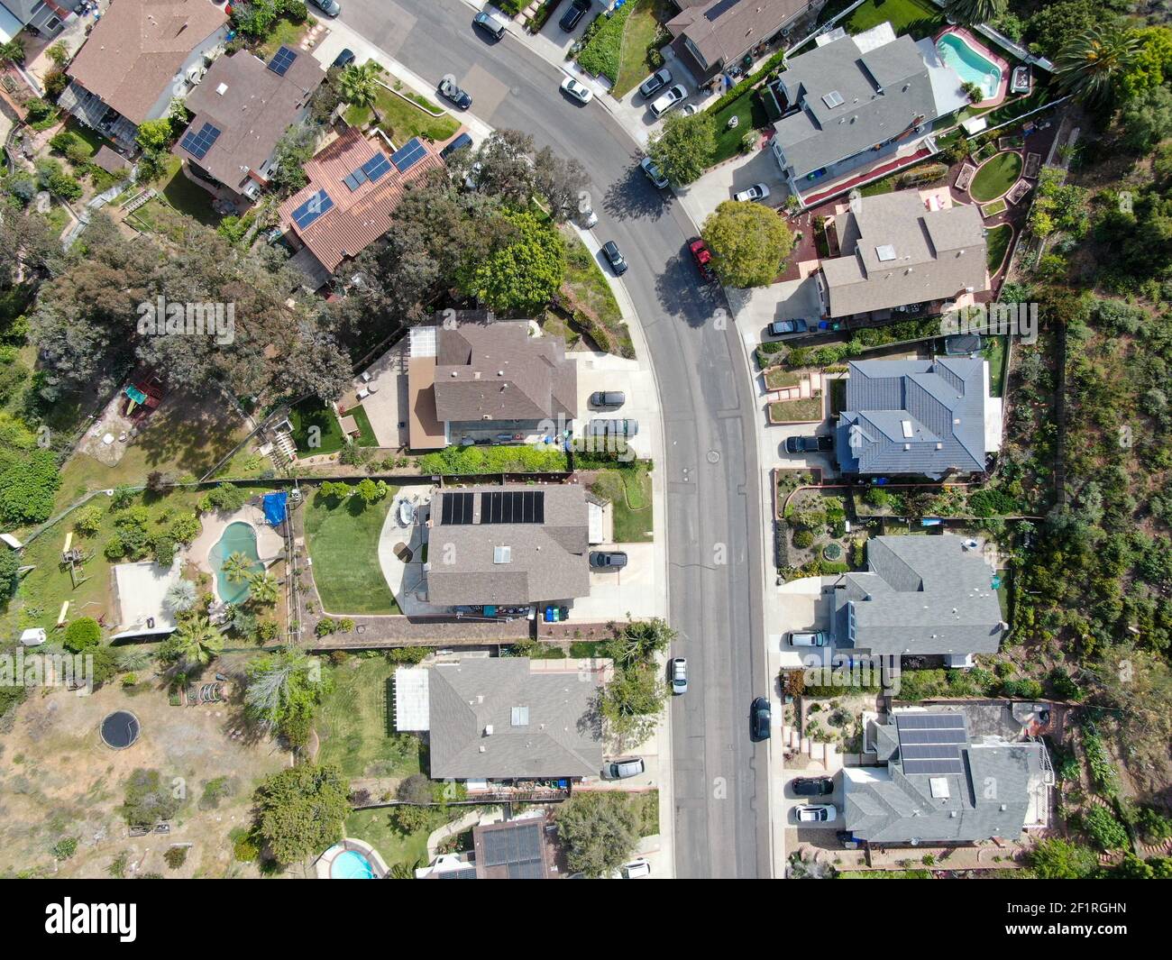 Aerial top view of upper middle class neighborhood street with ...