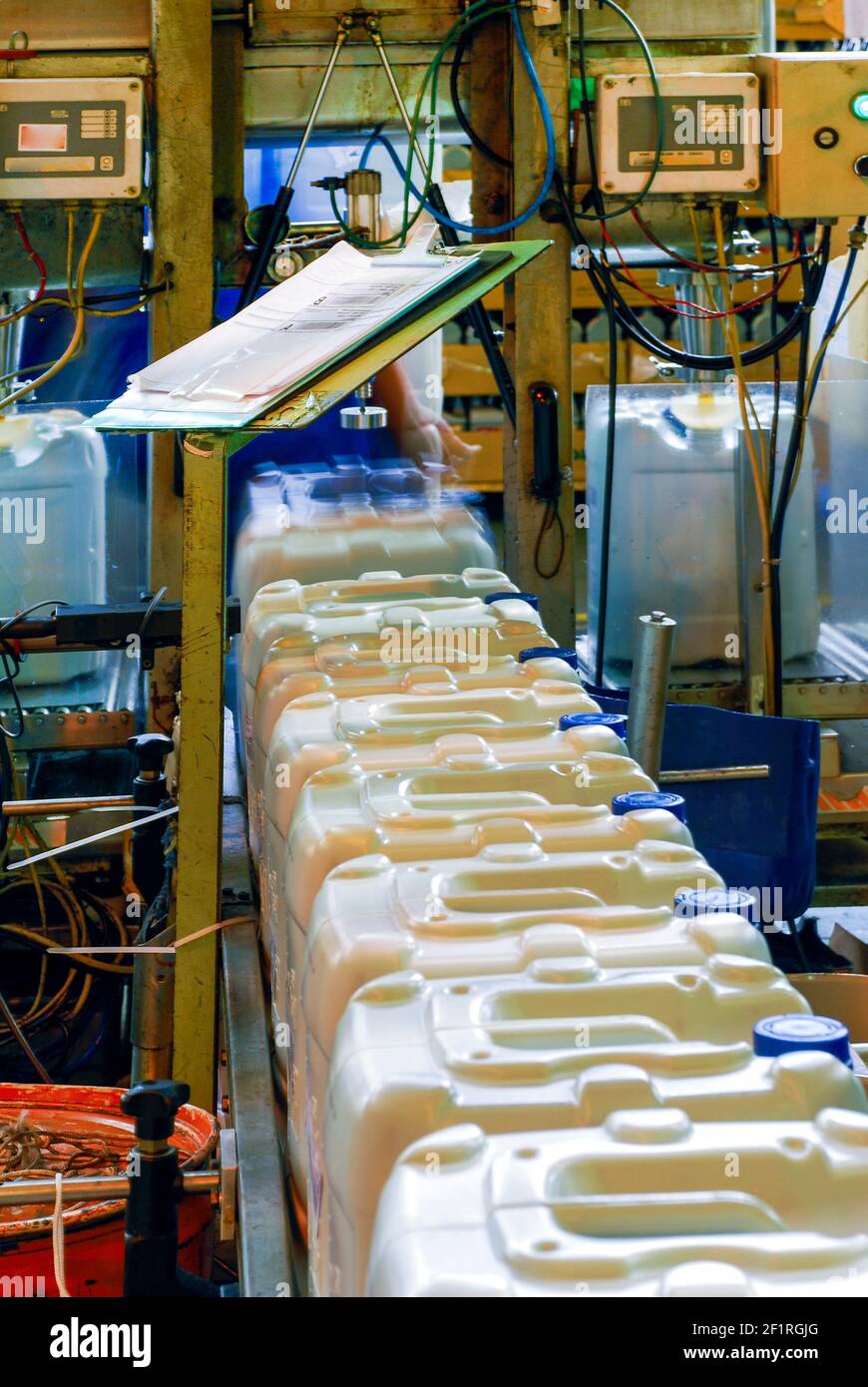 The oil is dispensed in the gallon at a lubricant factory Stock Photo ...