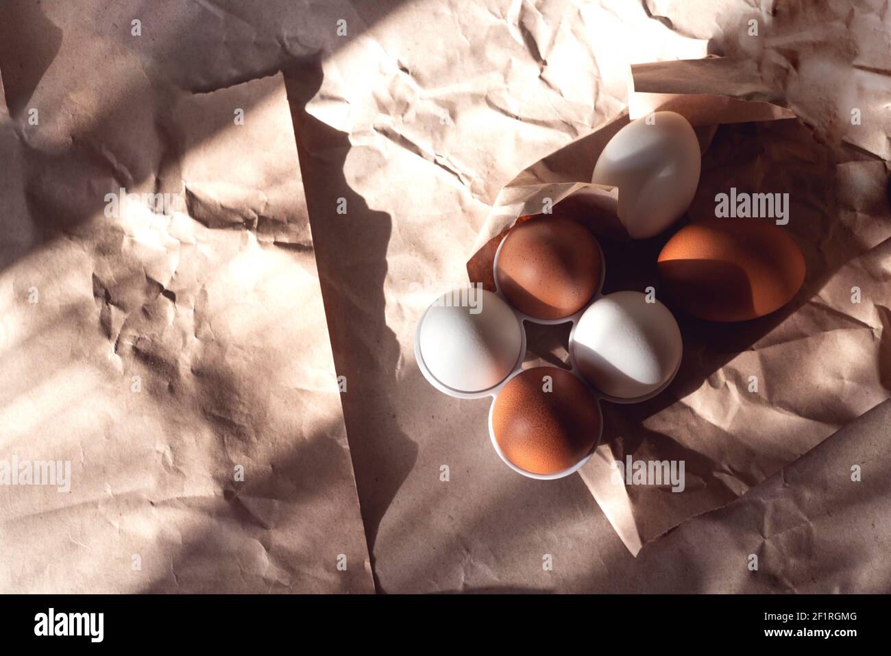 Eggs on crumpled paper Stock Photo - Alamy