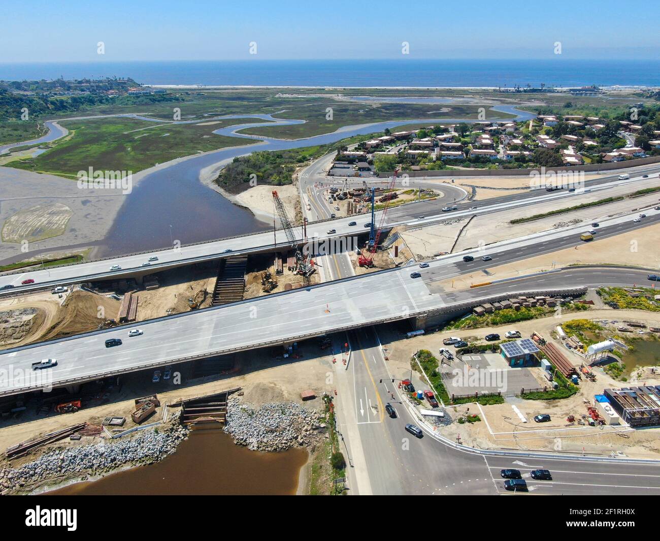 Aerial view of highway bridge construction over small river Stock Photo ...