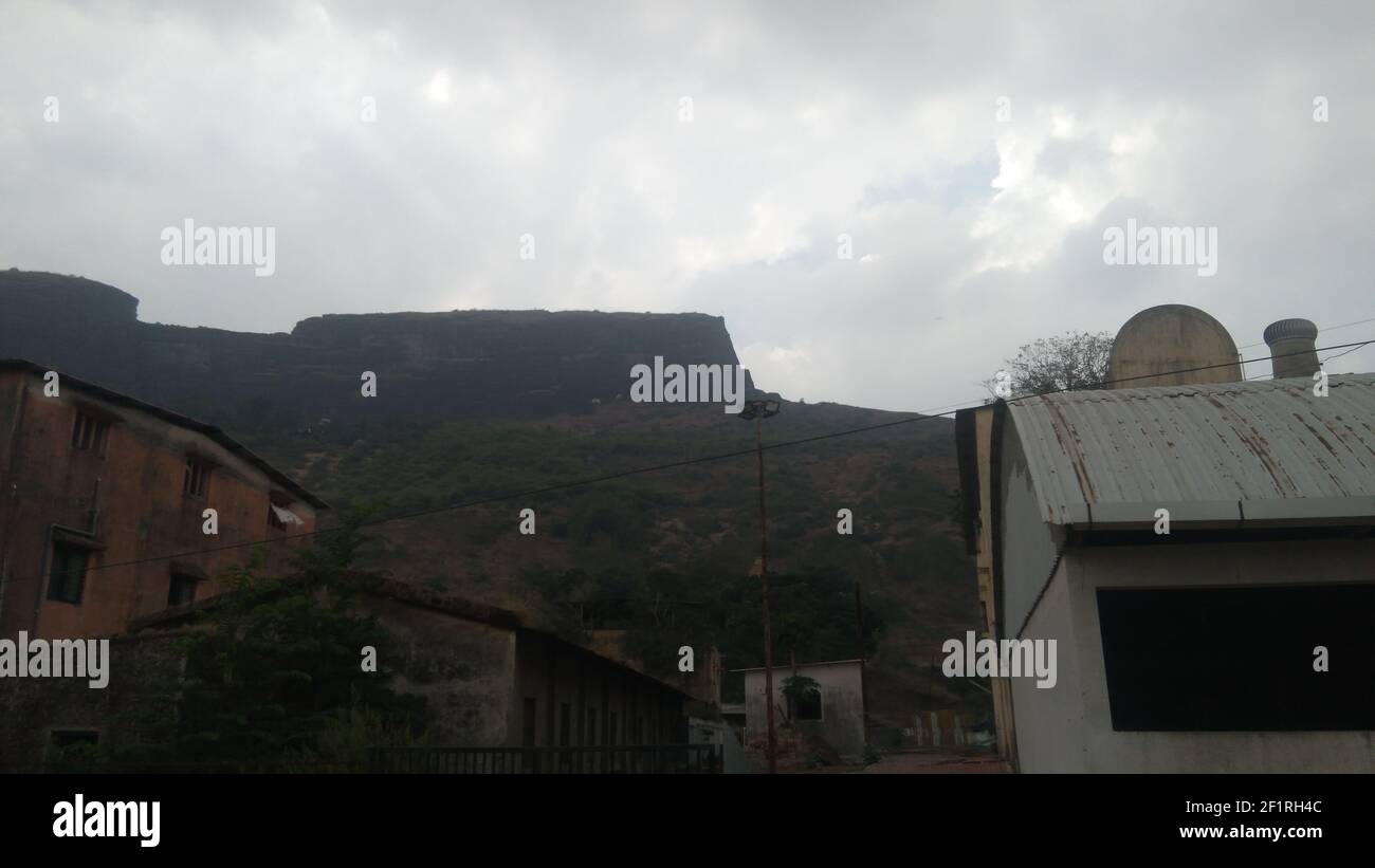 View of brahmagiri parvat (mountain) with cloudy sky in trimbak, nashik ...
