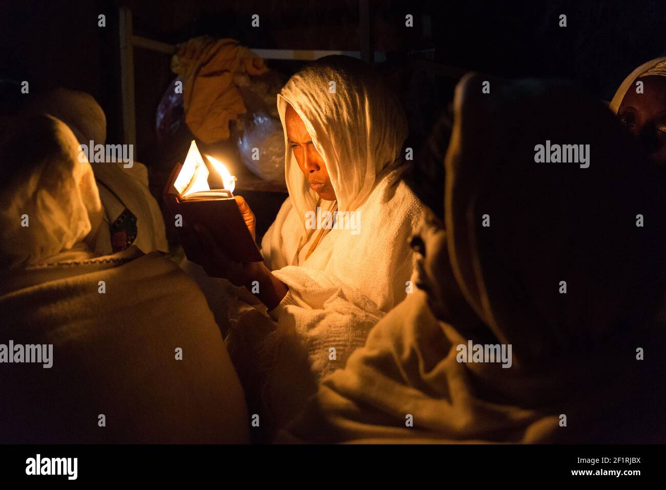 Pilgrims inside the tunnel entrance at St. Emmanuel Church reading ...