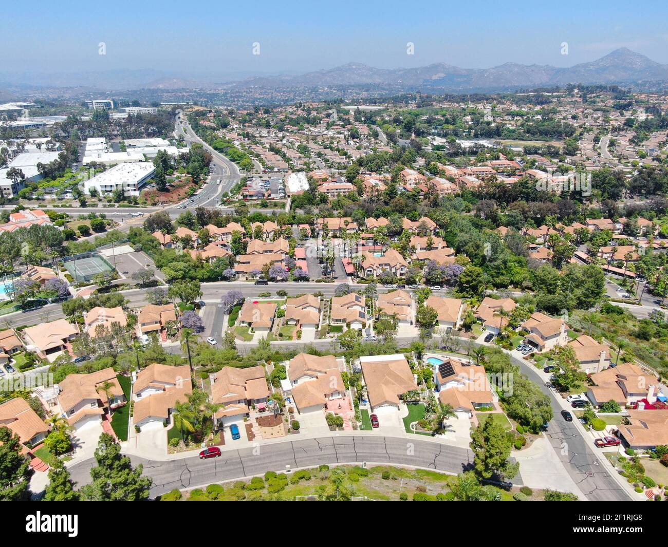 Aerial view of middle class neighborhood street with residential house ...